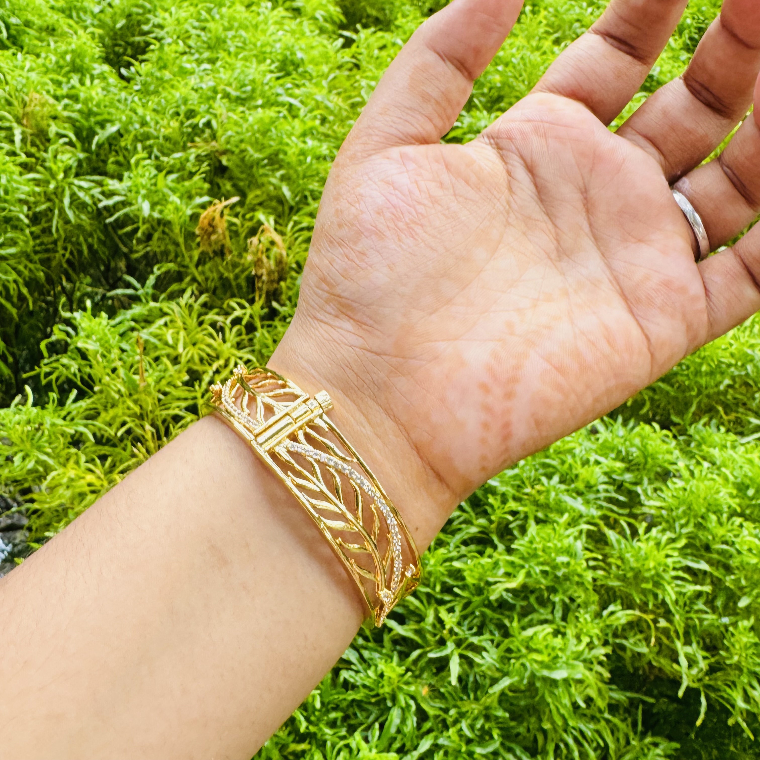 Gold plated rich look nut bangle with white stone leaf design bangle ...