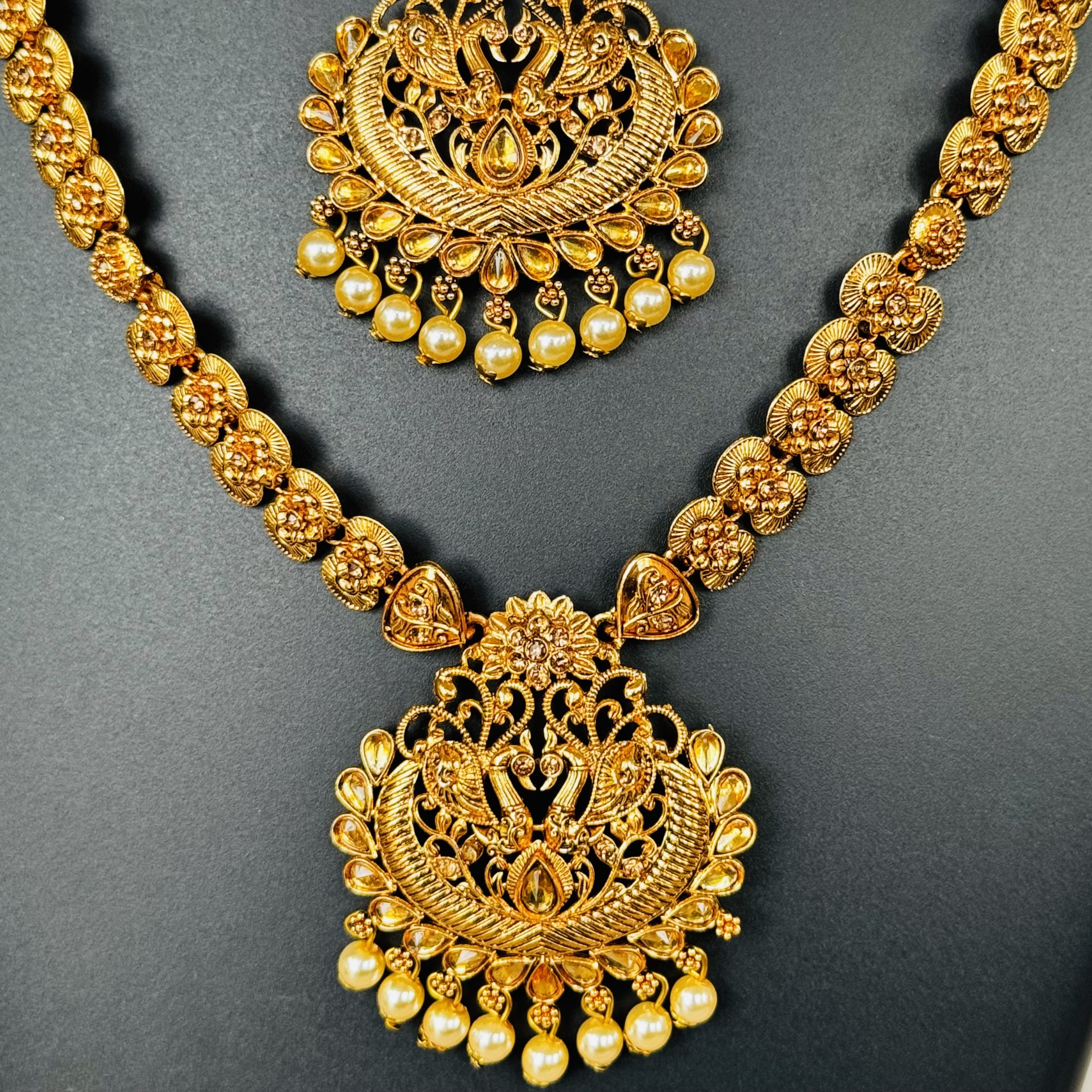 Dull gold color big double necklace flower and peacock design with one ...